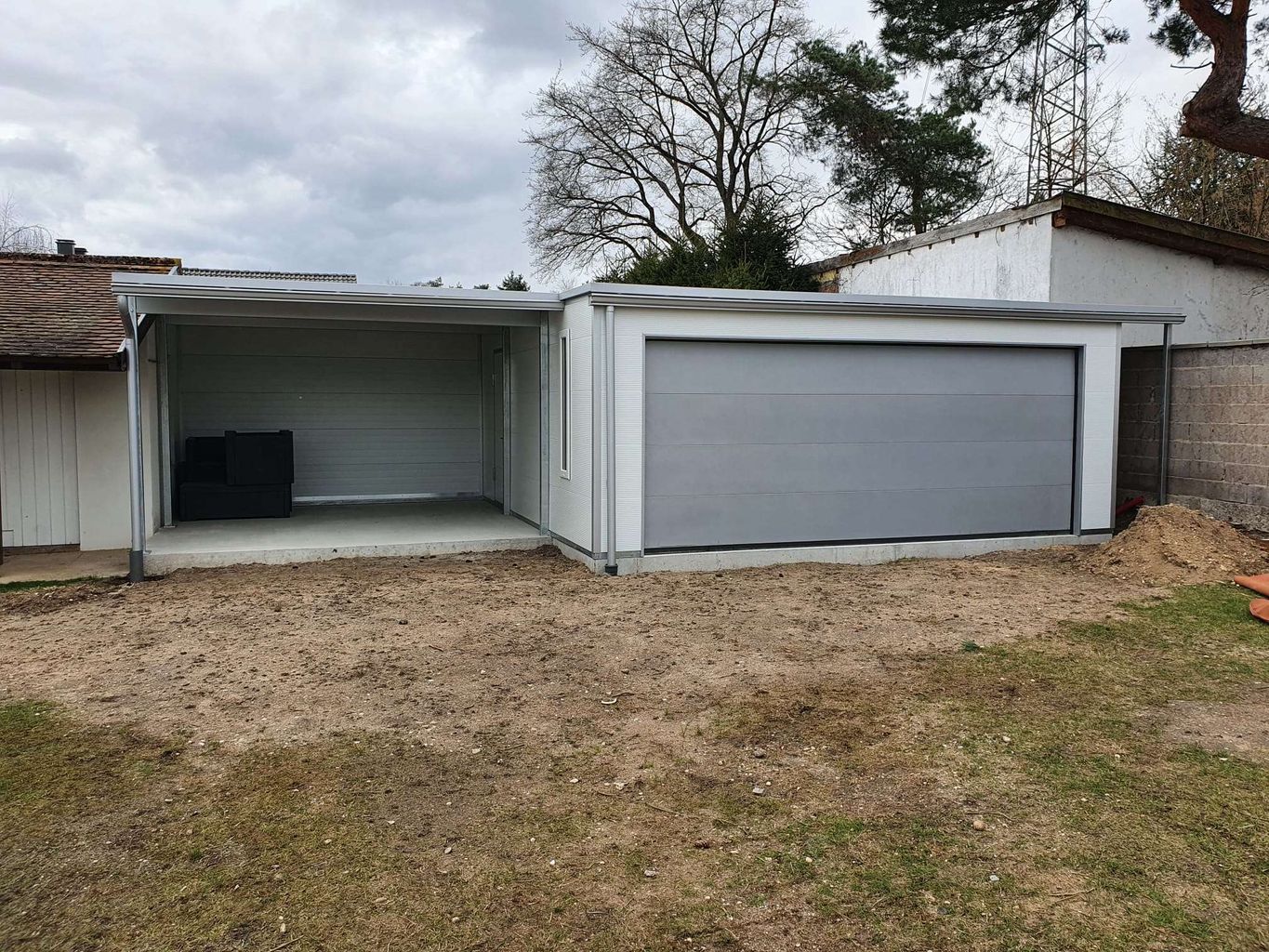 Doppelgarage mit carport , garatec | homify